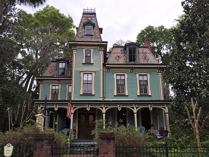 Gothic revival meets Southern charm at this historic Gainesville home, its mint-green exterior and intricate details transporting visitors to Victorian times.