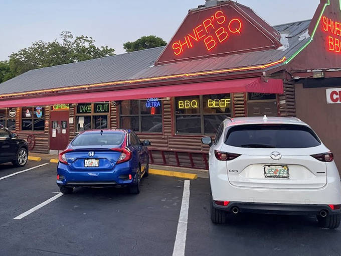 Shiver's BBQ glows with neon promise as its red sign lights up the night, beckoning BBQ lovers to this Homestead institution.