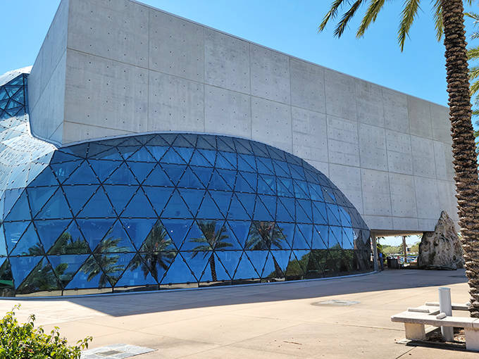 The Dali Museum's striking modern architecture features a geodesic glass bubble emerging from concrete walls.