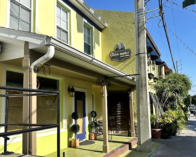 The Goblin Market's charming yellow exterior hints at the literary-themed dining experience waiting inside this Mount Dora gem.