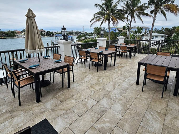 Panoramic water views stretch from Castile's elevated dining space. The perfect setting for watching boats return to harbor as the sun sets.
