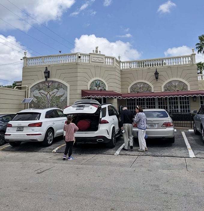 The palace-like architecture of Versailles makes it an unmistakable Miami landmark where Cuban coffee and conversation flow freely at all hours.