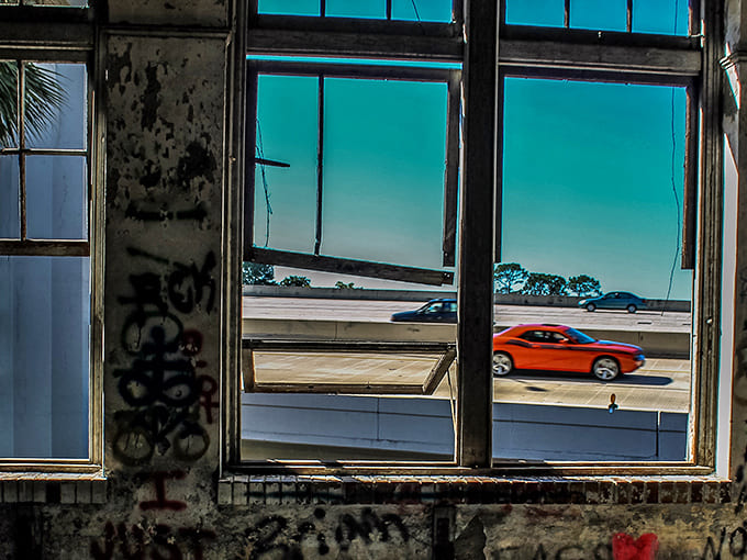 These windows frame a view of modern Jacksonville, the building watching the world move on like a grandparent observing their grandchildren's busy lives.