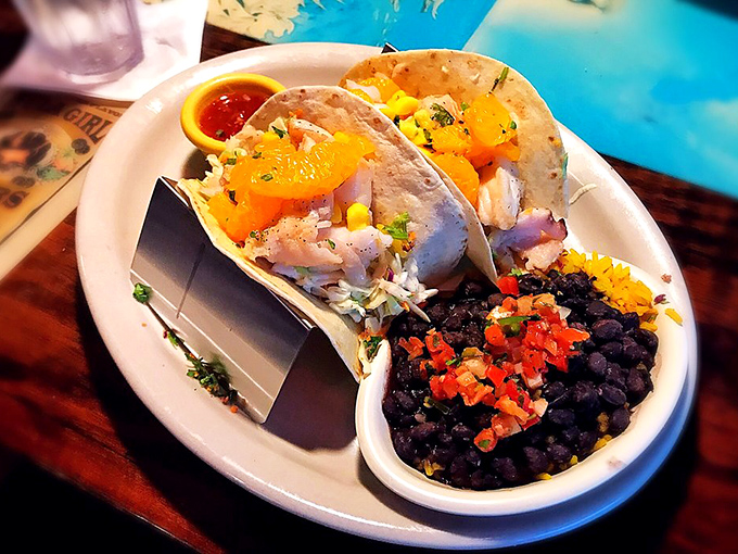 Fish tacos that tell a story of ocean freshness. Those black beans aren't just a side &ndash; they're a supporting character worthy of an award.