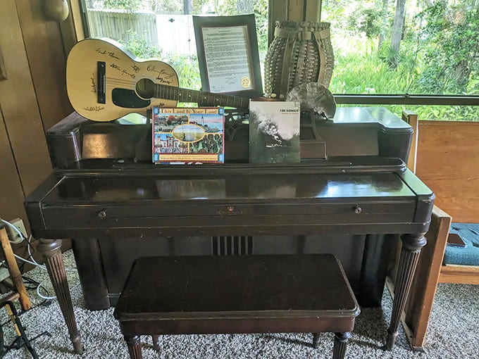 Musical instruments remind visitors that Kennedy's legacy includes preserving Florida's folk traditions, not just fighting the Klan on weekends.