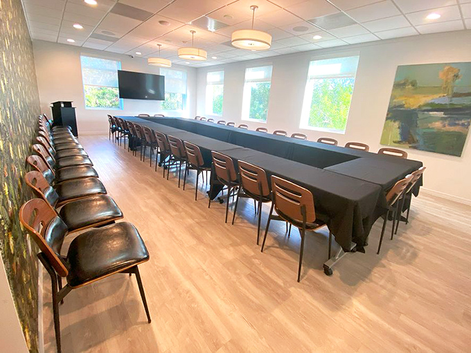 Important decisions are made in this light-filled boardroom, where creativity and community planning happen with Florida sunshine as witness.