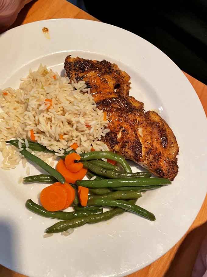 Blackened grouper with rice and vegetables showcases Florida's fresh seafood prepared with skill and served with pride every single time.