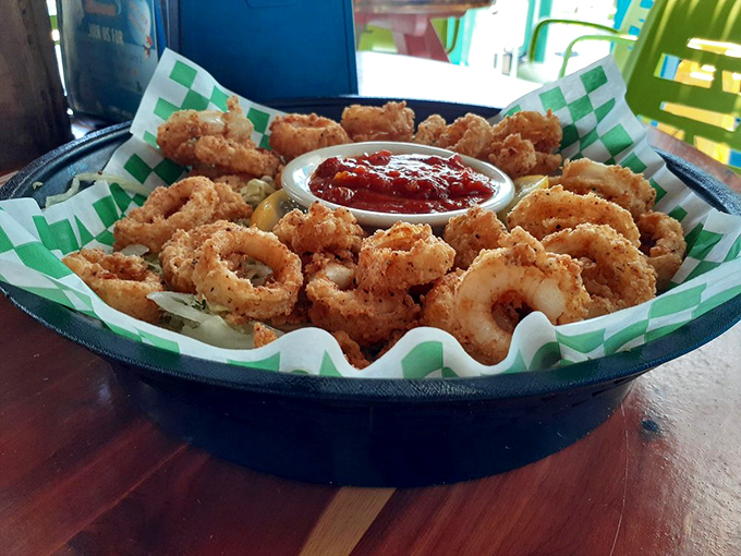 Crispy calamari rings that could double as delicious edible jewelry, with marinara sauce standing by for dunking duty.