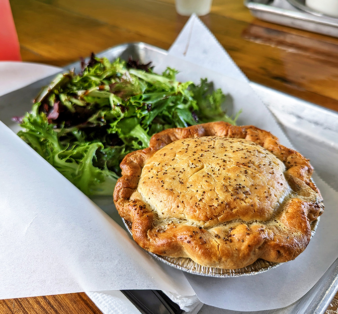 A golden-crusted pot pie with a side of fresh greens&mdash;because sometimes you need a token vegetable with your comfort food masterpiece.