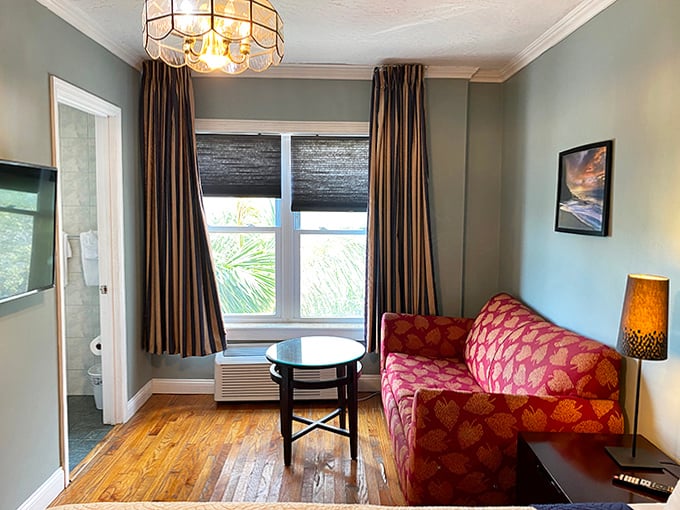A cozy corner that says "cancel your plans and stay in." The pink sofa practically begs for you to curl up with a book or contemplate life's mysteries.
