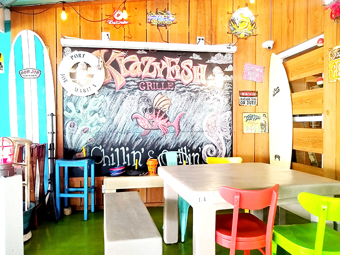 Wooden walls adorned with coastal art and surfboards create the perfect backdrop for seafood feasts and vacation stories.
