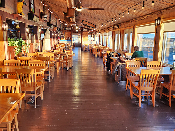 The dining area stretches along the waterfront, where every table feels like the best seat in the house.