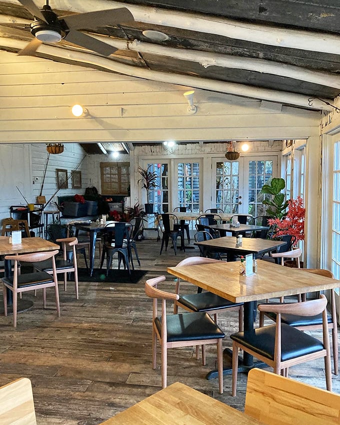Rustic charm meets coastal comfort in a dining room where weathered wood and natural light create the perfect backdrop for seafood feasts.