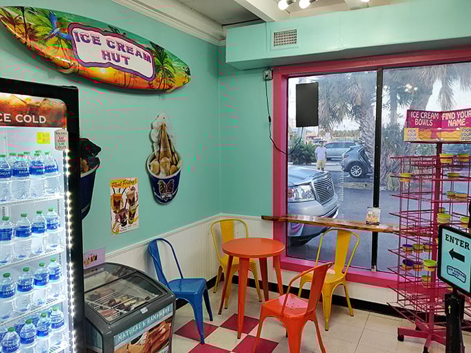 Colorful metal chairs and a surfboard on the wall create a casual, beachy vibe perfect for enjoying your frozen masterpiece.