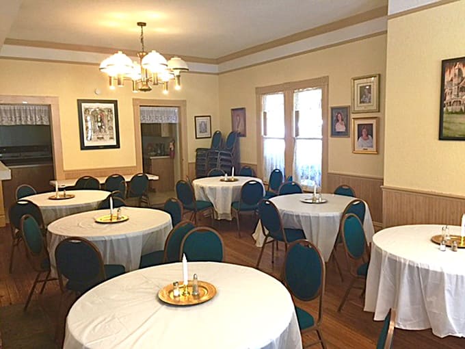 The dining room looks ready for guests, which is convenient since some of the previous occupants apparently never left the table.