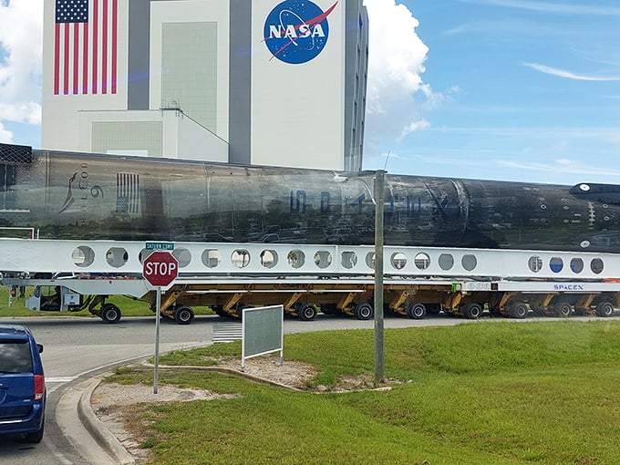An incredible view of a SpaceX Falcon rocket stage being transported at Kennedy Space Center, a perfect photo op for a space enthusiast on Merritt Island.