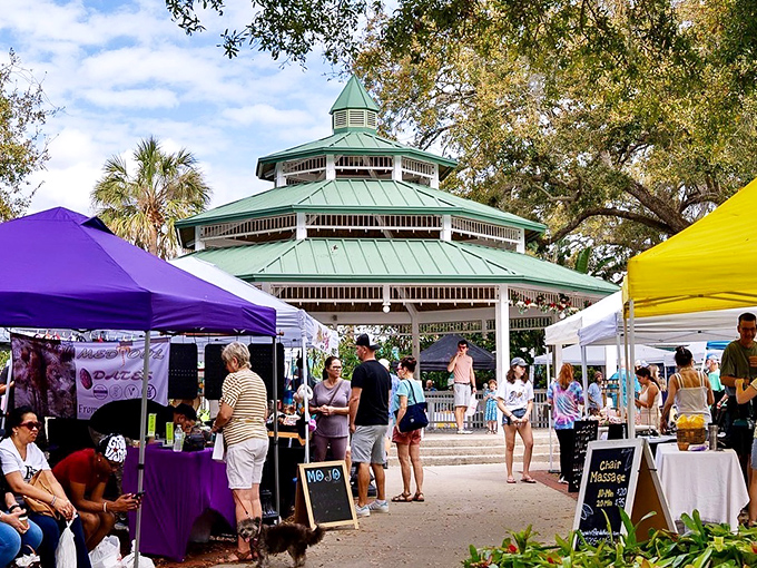 Market-goers gather under the gazebo's protective embrace, the unofficial town square where shopping becomes a social event.