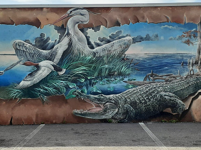 Florida's wild side emerges in this striking wildlife mural, where herons and alligators coexist in the delicate dance of predator and prey.