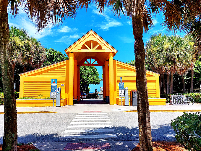 James H. Nance Park's bright yellow pavilion serves as a cheerful gateway between mainland life and beachside bliss.