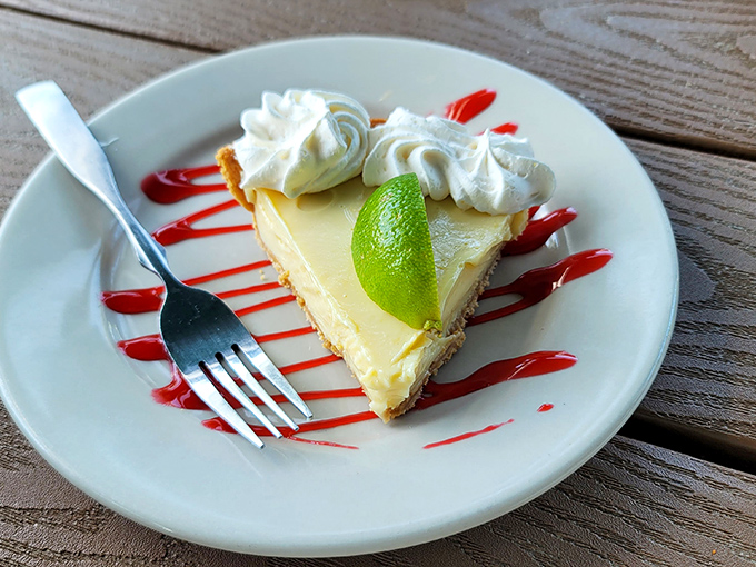 Key lime pie done right &ndash; tangy, sweet, with a buttery crust and that essential wedge of lime that separates the authentic from the pretenders.