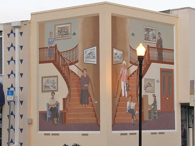 Women ascend and descend these painted stairs through time, their stories climbing out from history's shadows into deserved spotlight.