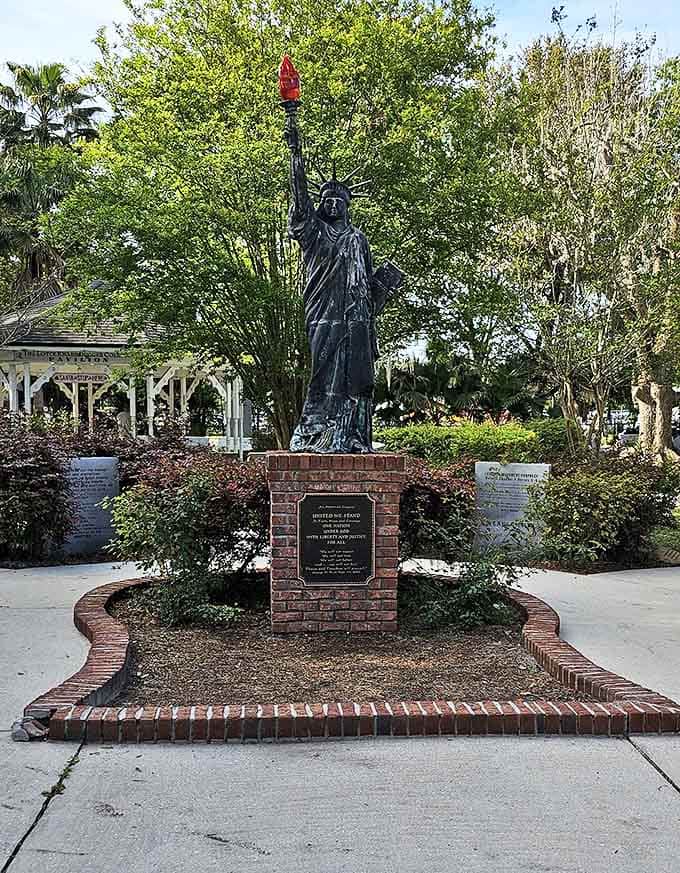 Standing tall among the trees, this impressive replica of Lady Liberty brings a touch of national pride to the village.