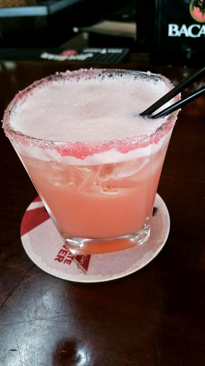 This pink flamingo cocktail looks like a Florida sunset in a glass and probably tastes even better than it looks on a warm evening.