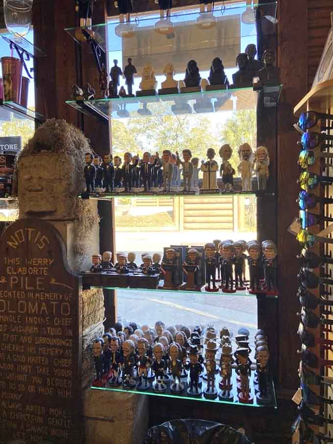 Rows of miniature figures and presidential bobbleheads create a tiny army of fame, like someone shrunk Hollywood and put it on display.