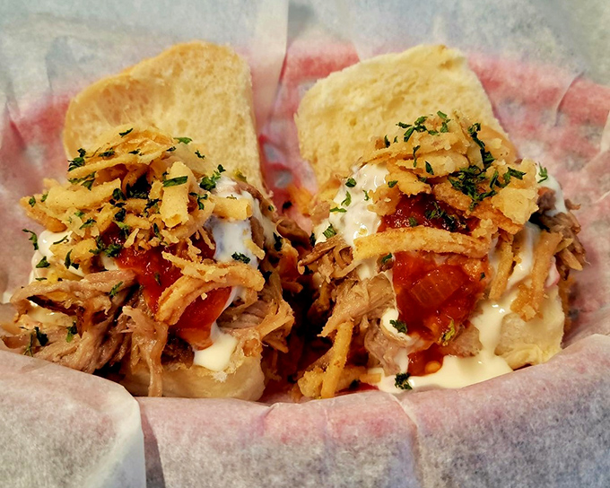 These pulled pork sliders aren't just topped &ndash; they're crowned with crispy onions and sauce, creating tiny thrones of flavor.