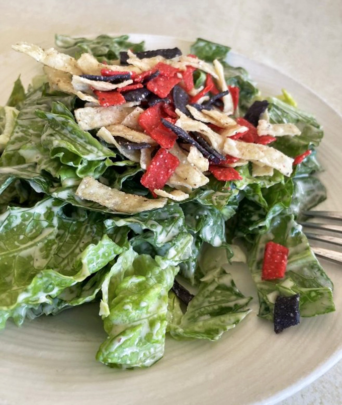 Crisp greens adorned with colorful tortilla confetti &ndash; proof that salads don't have to be punishment between indulgences.