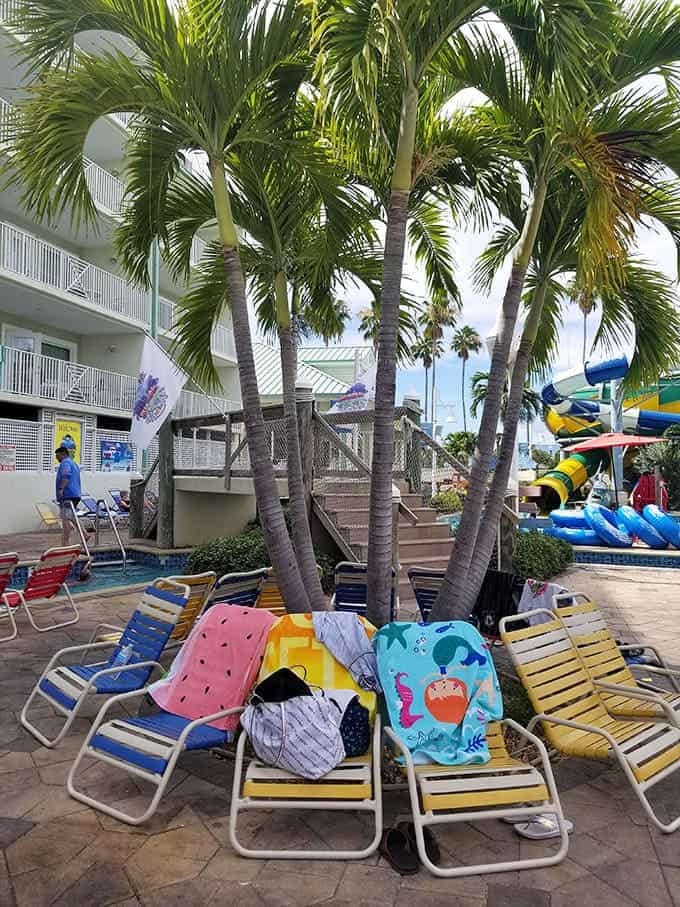 Palm trees and lounge chairs create the perfect setup for parents who've mastered the art of relaxing while technically still supervising.