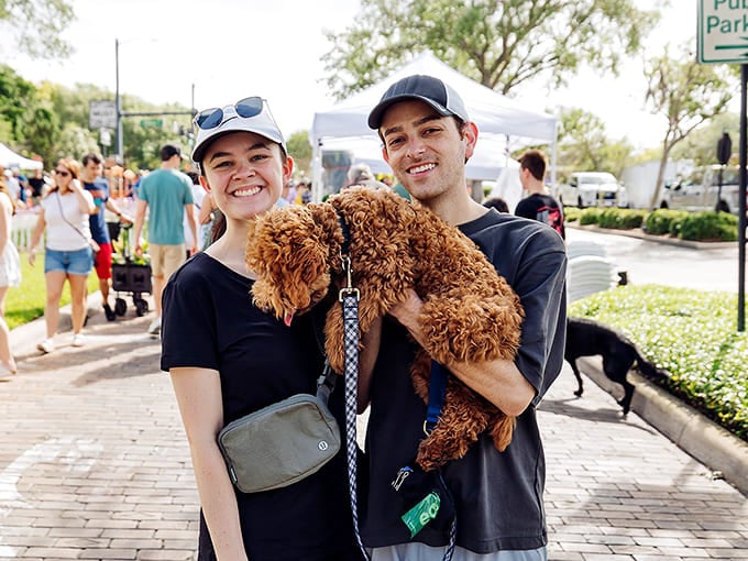 Even the four-legged friends get to enjoy the festivities, because apparently dogs appreciate garden festivals too, or at least the walking part.