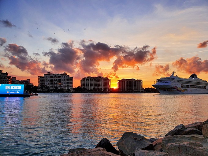 Miami's skyline silhouetted against a sky that looks like someone spilled the good paint. Nature showing off again.