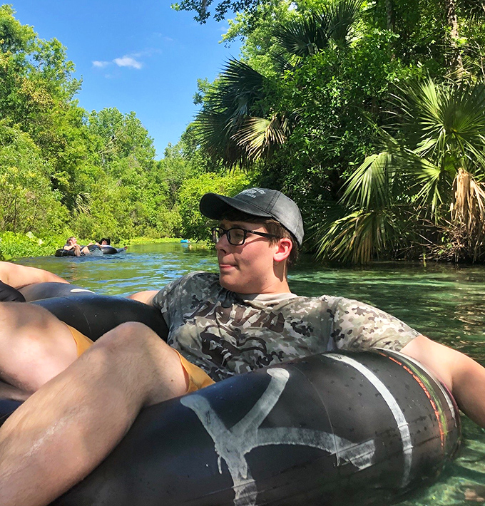 A visitor floats carefree in an inner tube, practicing what Floridians call "advanced relaxation techniques."