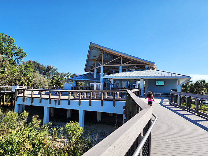 The visitor center welcomes explorers with its airy design, promising educational treasures inside that rival the wildlife wonders outside.