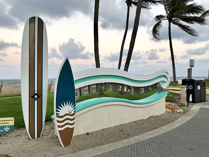 Surfboards stand ready for adventure at Deerfield's entrance &ndash; silent promises of waves waiting to be caught.