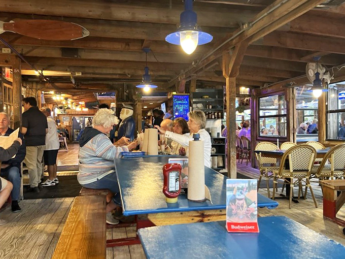 The dining room buzzes with conversation as patrons enjoy the timeless pleasure of good food in good company.