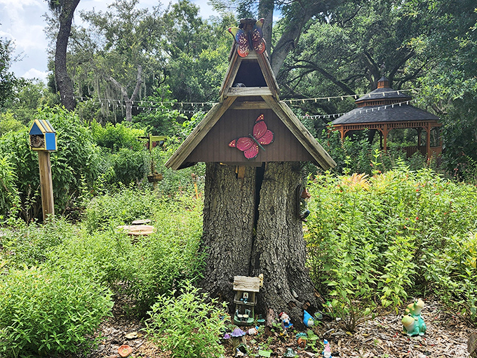 Fairy garden magic transforms an ordinary tree stump into an enchanted dwelling that sparks imagination in visitors of all ages.