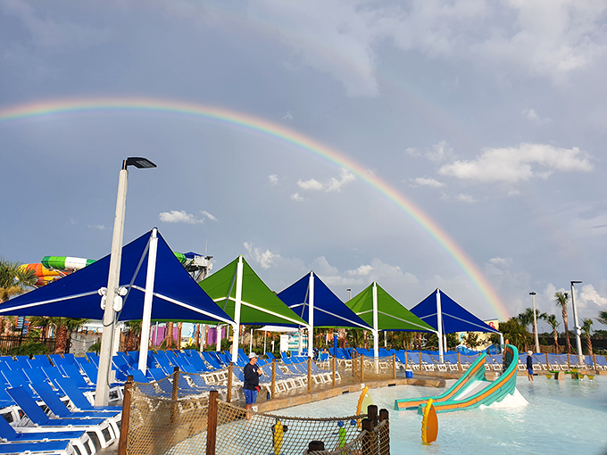 Nature adds its own special effect as a rainbow arches over the park, as if approving of all the watery fun below.