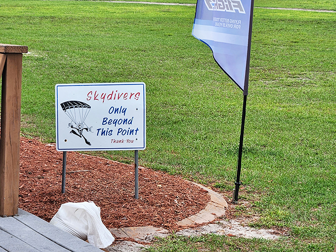 This sign establishes clear boundaries, because apparently some people need reminding that skydiving areas aren't for casual strolling.