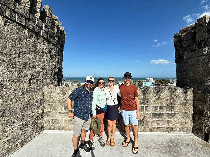 Visitors enjoying the castle's unique vantage point, where medieval fantasy meets Florida's coastal reality.