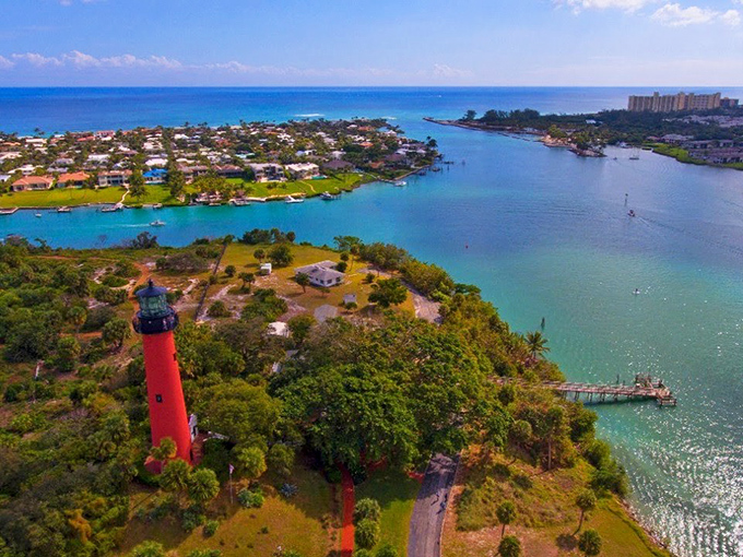 Jupiter's iconic red lighthouse stands sentinel over the meeting point of the Loxahatchee River and the Atlantic Ocean.