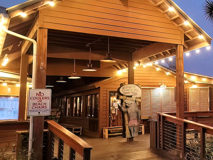 Sharky's wooden boardwalk entrance welcomes beach-goers to dine with their toes still sandy from the Gulf.