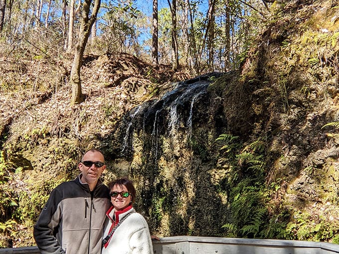 A couple poses at the waterfall overlook, proving that Florida can do dramatic landscapes when it tries.
