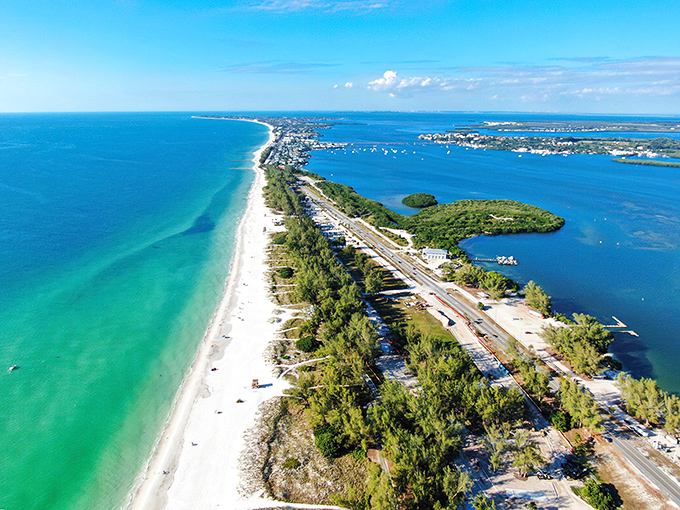 Anna Maria Island stretches like a protective arm along Florida's Gulf Coast, where turquoise waters meet powdery white sand in a perfect vacation embrace.