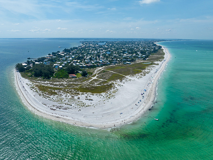 Bean Point Where two waters embrace at Anna Maria Island's northern tip, creating a paradise that feels like Florida's best-kept secret.