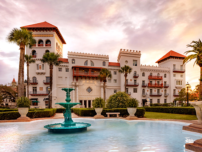 The Casa Monica Resort & Spa stands like a Moroccan mirage in St. Augustine, its white walls and terra-cotta roofs creating an exotic silhouette against the Florida sky.