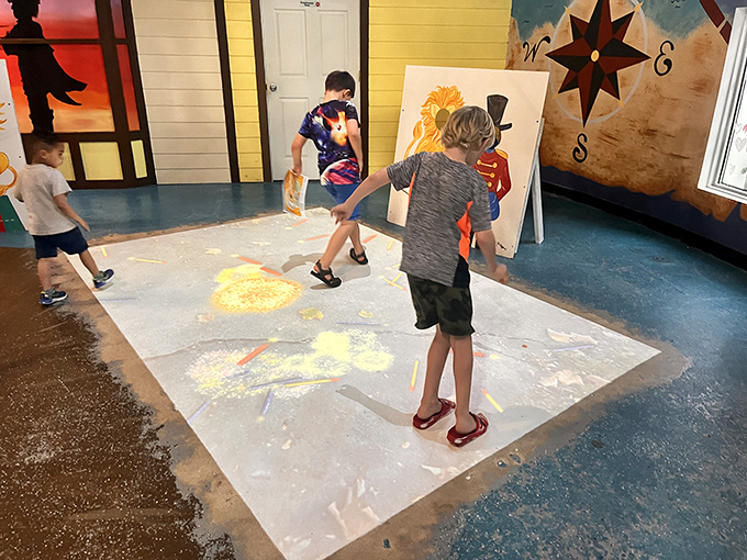Young artists transform a blank canvas into a masterpiece of color and imagination at the interactive art station.