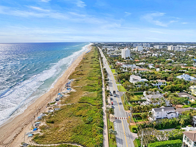 Delray Beach's coastline stretches like nature's welcome mat, where azure waters meet golden sands under Florida's impossibly blue skies.