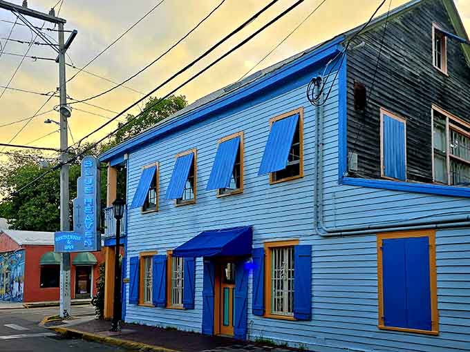 That electric blue exterior isn't just paint, it's a promise that normal rules don't apply inside this Key West treasure.
